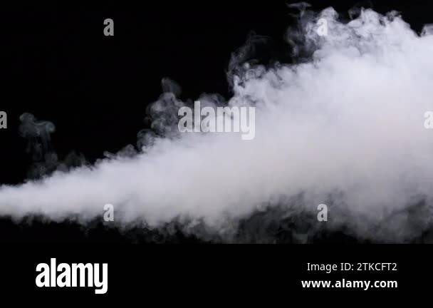 Jet stream of smoke or vapor on black background in slow motion 4K ...