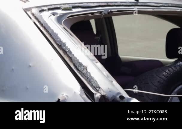 A car after an accident with a broken rear window. Broken window in a ...