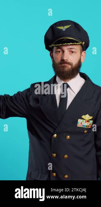 Vertical video: Professional aviator showing thumbs down sign ...