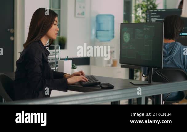 Asian IT engineer encountering system failure error on computer ... Asian IT engineer encountering system failure error on computer ...
