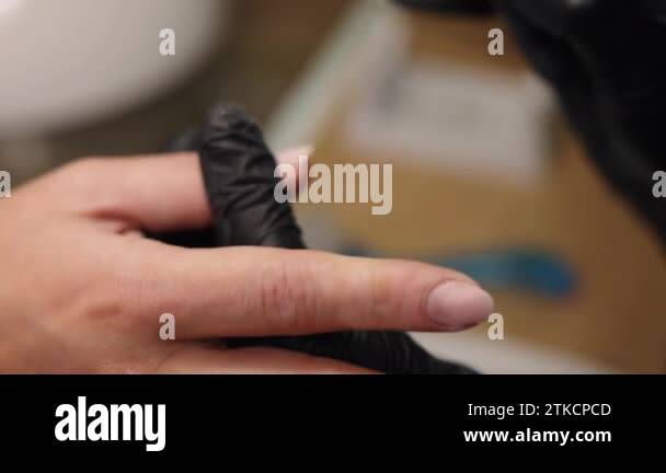 removing gel, manicure machine, Female master. Nail technician cleans ...