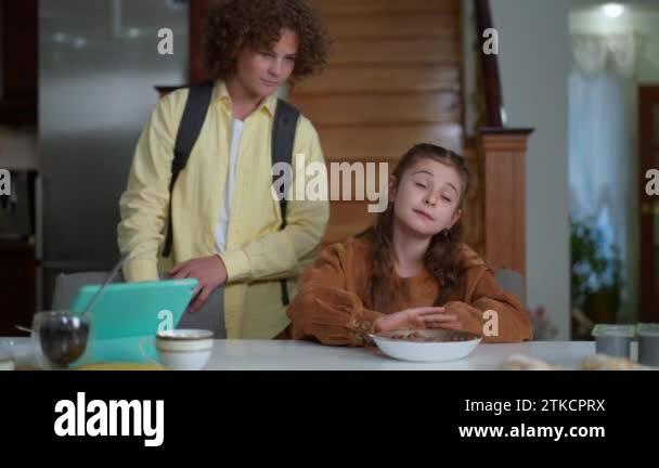 Beautiful Caucasian girl refusing eating breakfast cereal as smiling ...