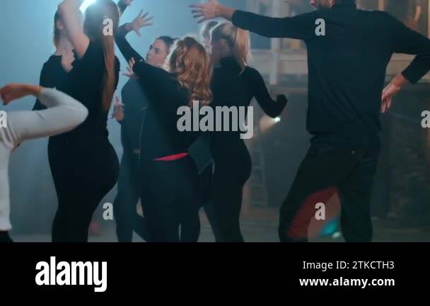 Group of theater actors walking to actress slowly stretching hands ...