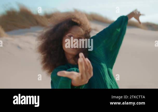 Flexible African American Woman Dancing Improvisation On Sand Dunes