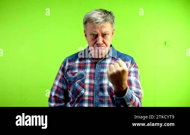 Disgruntled senior caucasian man lose control and threateningly showing ...