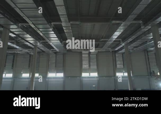 Ventilation ducts inside a large warehouse under construction Stock ...