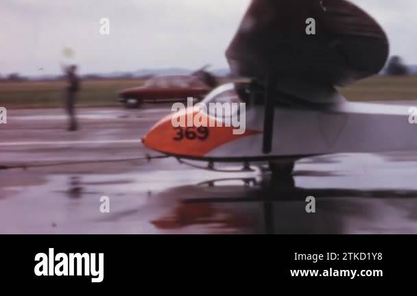 Take-off of a 1940s retro glider towed by winch in a historical video ...