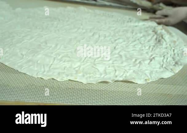 Food Factory makes automatic production of phyllo dough. Dough conveyor ...