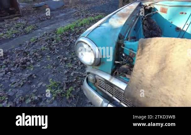 soviet retro broken car. Steadycam shot of broken rusty cars in green ...
