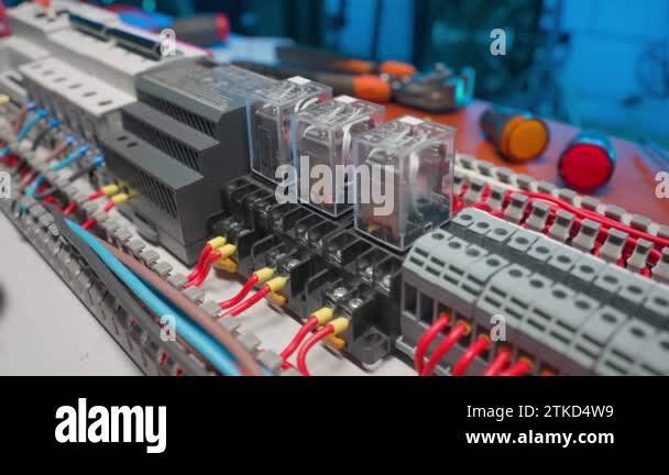 Electrical panel with many red and blue wires, electrical parts ...