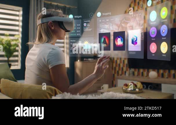 Woman in VR headset chooses clothes in online store chilling at home ...