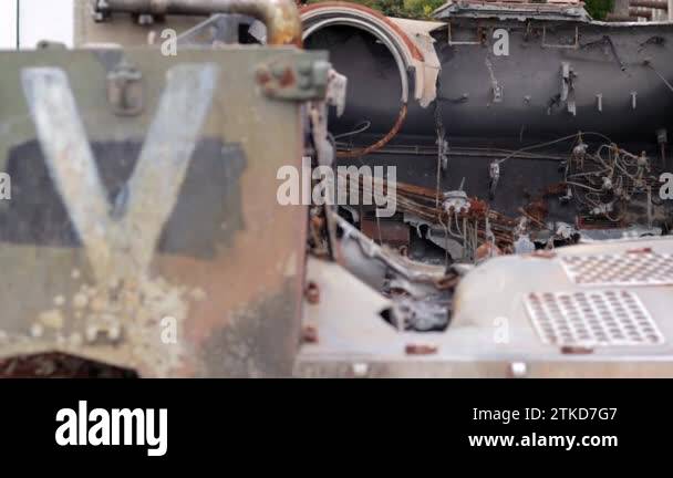 Destroyed, wrecked and burned T-72 tank with a designation V on it ...
