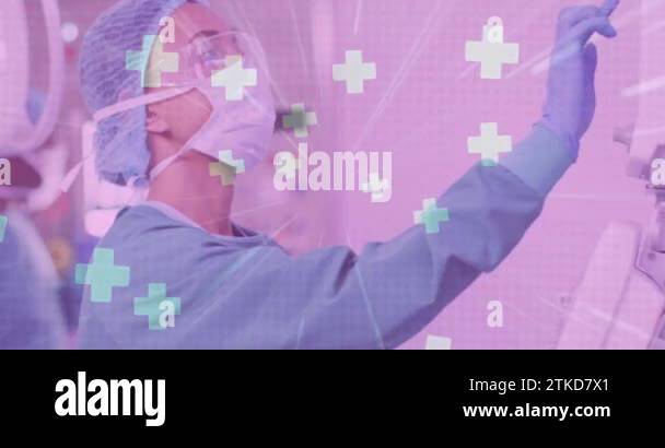 Animation of crosses and light trails over caucasian female surgeon at ...