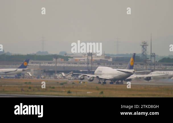 FRANKFURT AM MAIN, GERMANY - JULY 20, 2017: Boeing 747 Lufthansa taking off in a downpour at ...