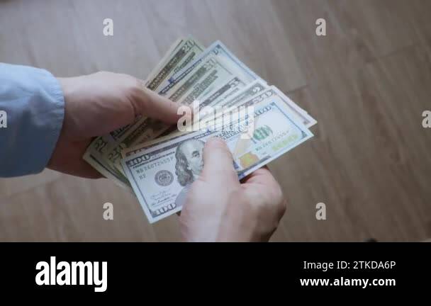 Man counting dollar bills. Close up of male hands count money cash ...
