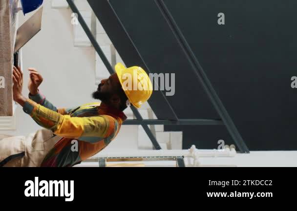 Vertical video: Team of warehouse employees taking boxes from racks ...