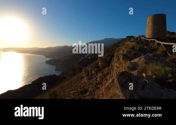 Mediterranean coastal landscape. Historic Torre Vigia De Cerro Gordo, a ...