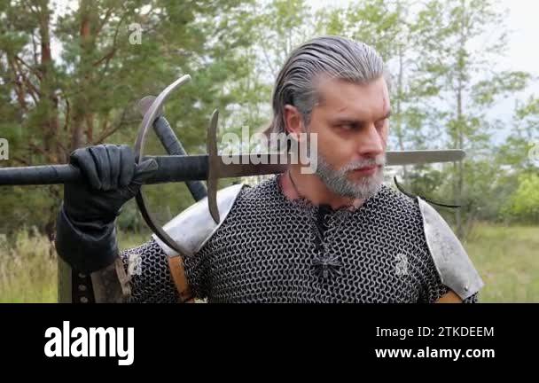 Portrait of a medieval warrior with gray hair and a scar on his face in ...