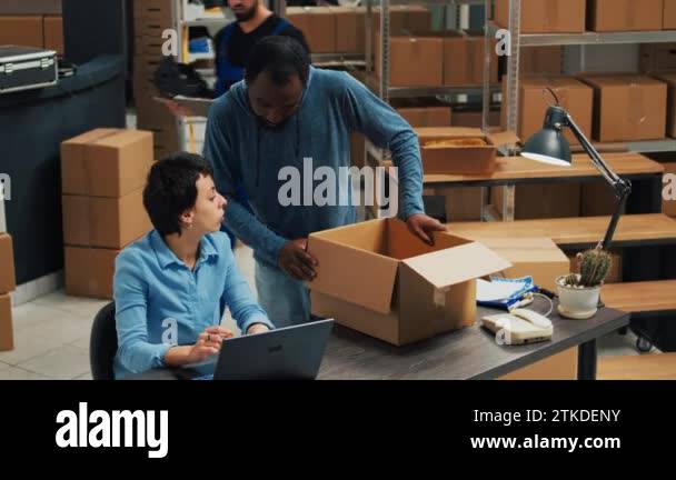 Team of employees working on shipping merchandise to clients, planning ...