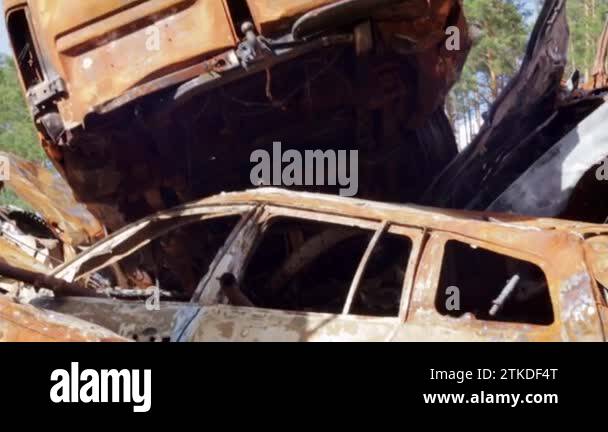 Burnt car body, riddled with bullets. War of Russia against Ukraine ...