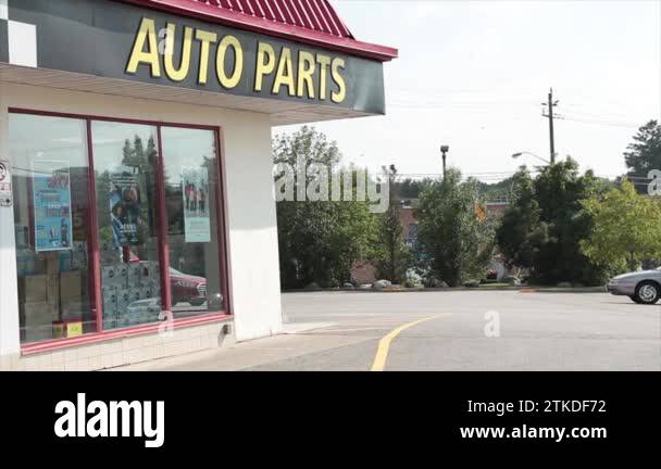 auto parts sign facade with roof above and windows below on storefront ...