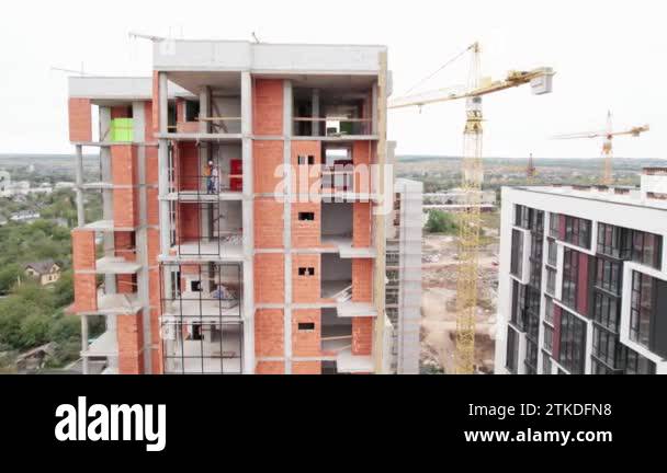 Man with wife and child standing inside residential building under ...