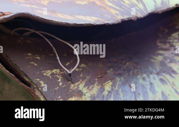 Hole or hole, armor deformation from a projectile close-up. Damaged ...