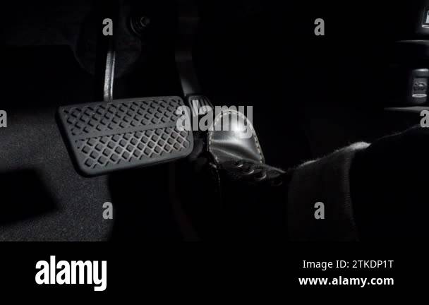 Accelerate and Brake. Foot pressing foot pedal of a car to drive ahead ...