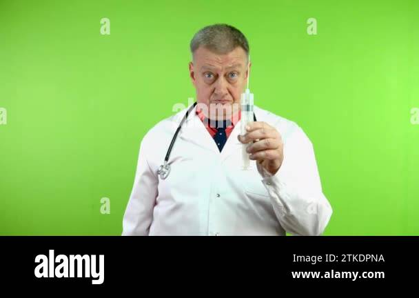Senior angry doctor physician threatens his index finger and big ...