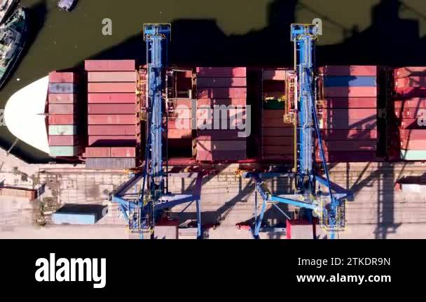 Container ship loading and unloading in port, Aerial view of logistic ...
