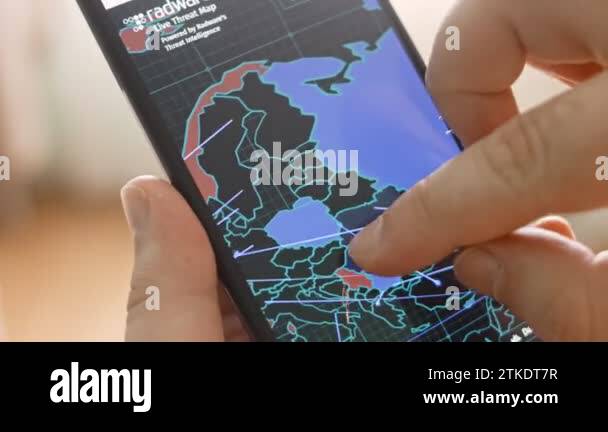 Cyber attack map navigation on smartphone. Displays Show Various ...