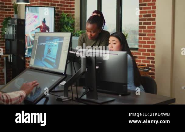 Diverse colleagues brainstorming ideas to create 3d content in creative agency studio, using ...