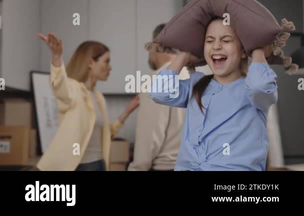 Domestic problem in family to divorce.The daughter is covering her ears ...