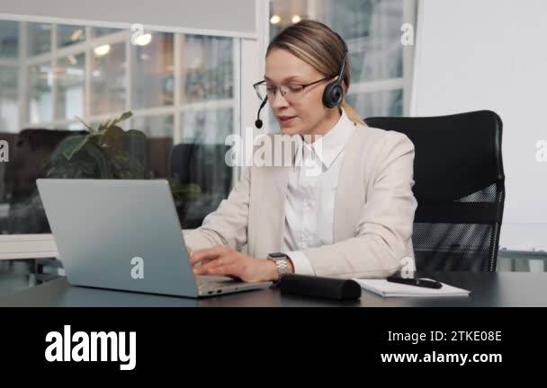 Top managerexecutive wears headset video calling on laptop ...