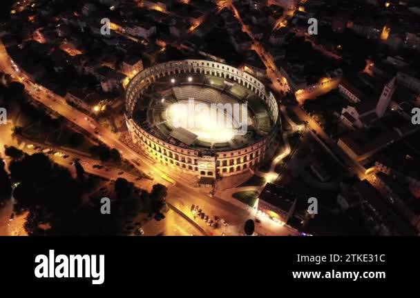 Amphitheatre in Pula, Croatia, night aerial view. Historic centre of ...