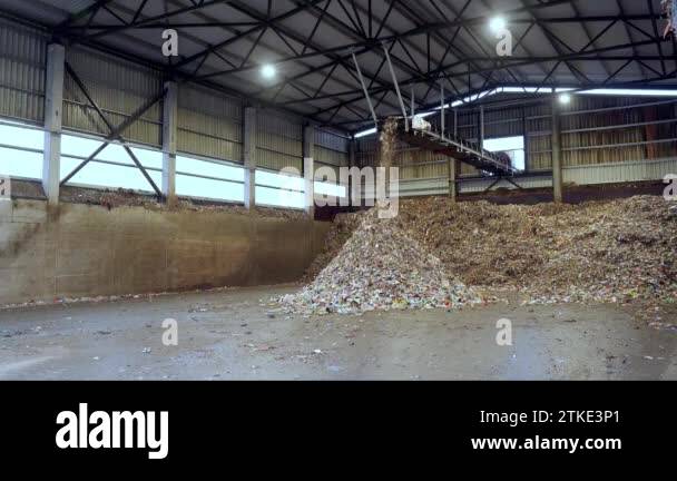 Trash disposal for recycling and reuse Bulldozer at garbage hangar ...