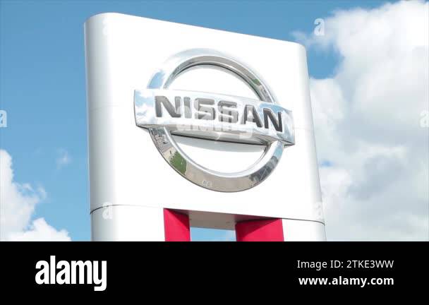nissan silver logo sign exterior outside outdoors on white red ...