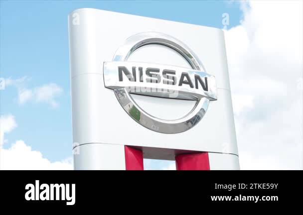 nissan silver logo sign exterior outside outdoors on white red ...