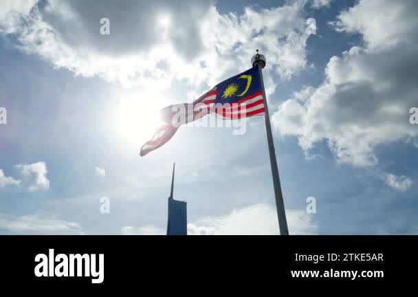 Aerial tracking Malaysia flag at Dataran Merdeka with background of ...