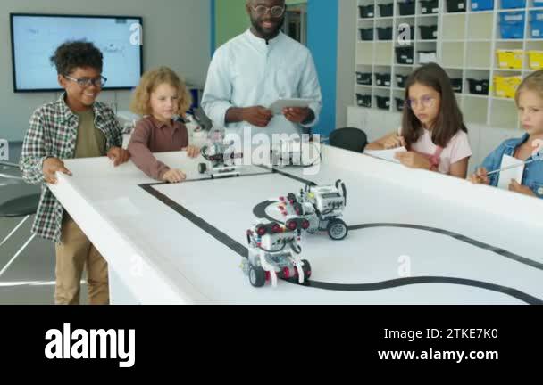 Full shot of group of young multiethnic boys and girls and black male ...