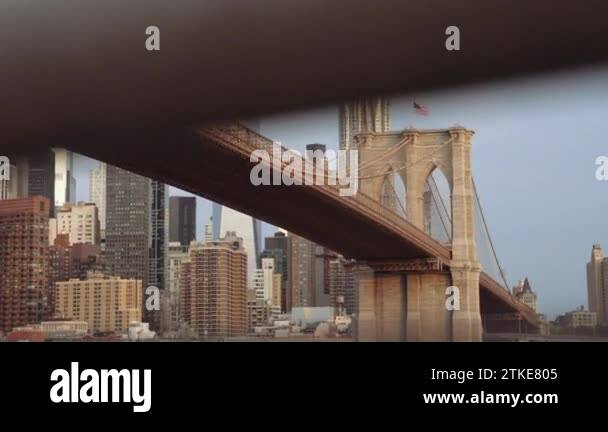 A tilt shot moving upwards from a blurry steel railing showing the ...