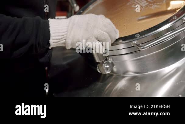 A working man closes the lid where the beer is brewed. flowing beer ...