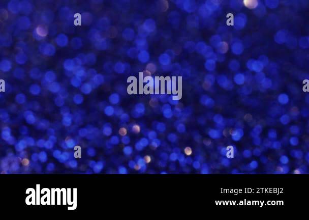Defocused lights. Blue background. Spangle magic. Bright electric color ...