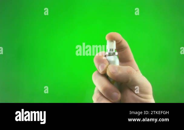 spray can man presses a button on an aerosol can, releasing chemicals ...