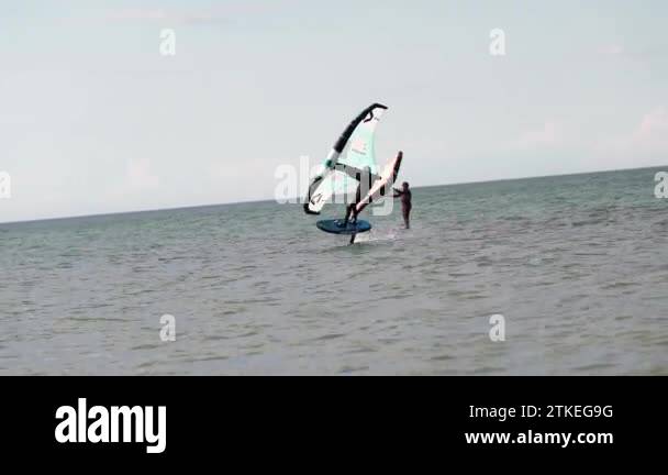 Modern water sport. Hydrofoil ride on the ocean using the wing and the ...