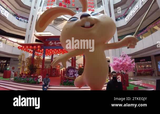 Sky Avenue mall, Kuala Lumpur, Malaysia - January 2023: Cute golden rabbits and Chinese pagoda ...
