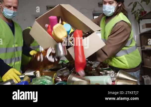 Workers Materials Recovery Facility sort recyclable waste into paper ...