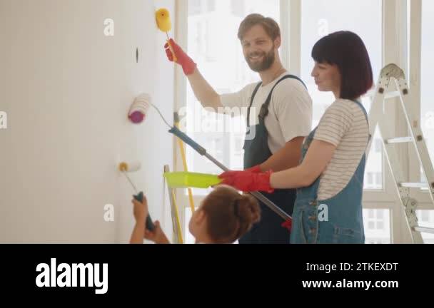 Repair in the apartment. Happy family. Happy family mother, father and ...