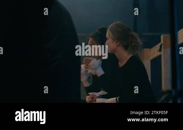 Theater actresses drinking hot tea on break on rehearsal. Side view ...