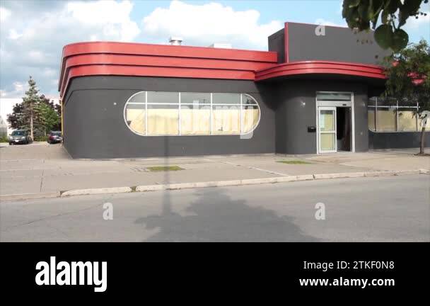empty vacant restaurant store storefront with windows covered from ...